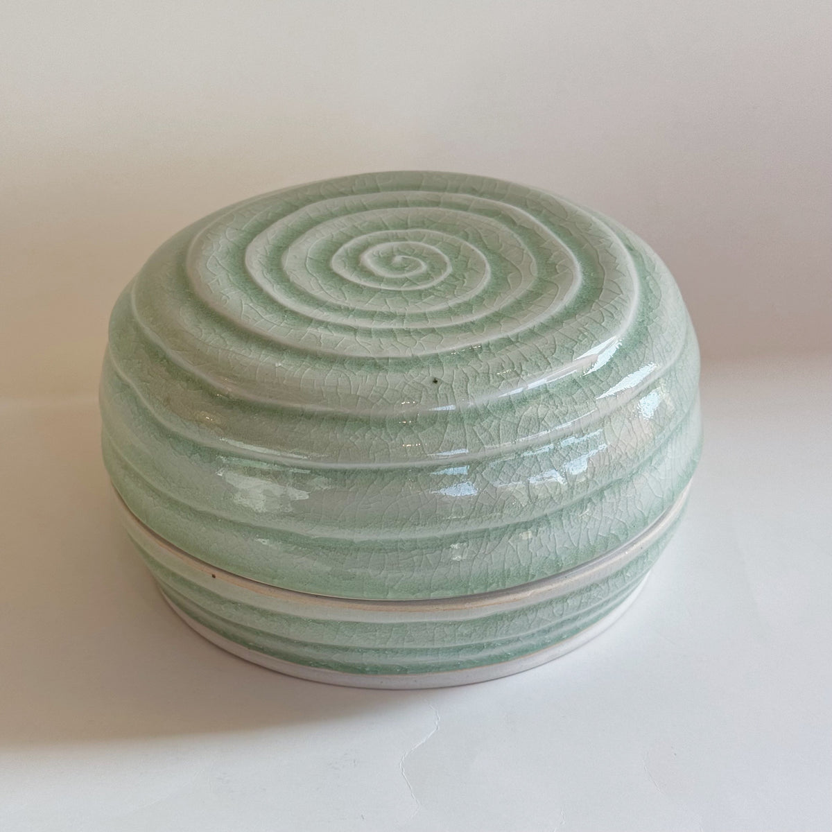 Swirl Lidded Vessel | Panther Pots by Ayden Krzmarzick – Ruby Clay Company